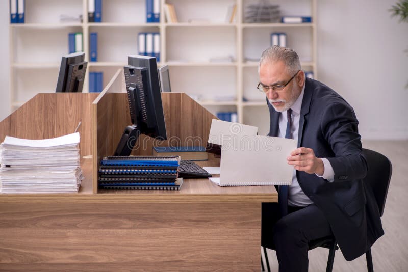 Old Male Employer and Too Much Work in the Office Stock Image - Image ...