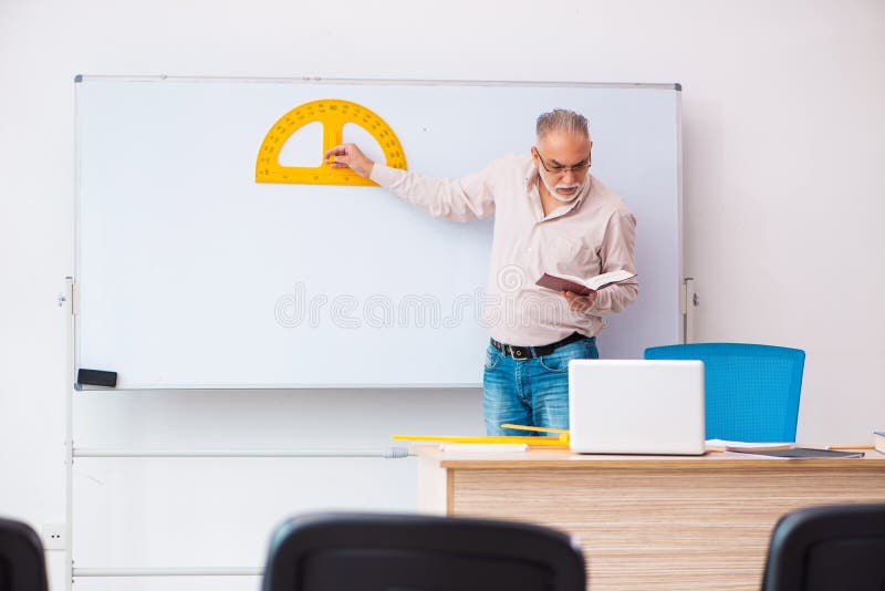 Old Male Geometry Teacher in the Classroom in Pandemic Concept Stock ...