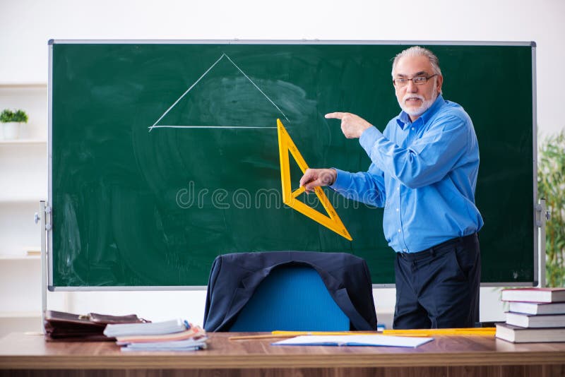 Old Male Geometry Teacher Holding Triangle Stock Photo - Image of ...