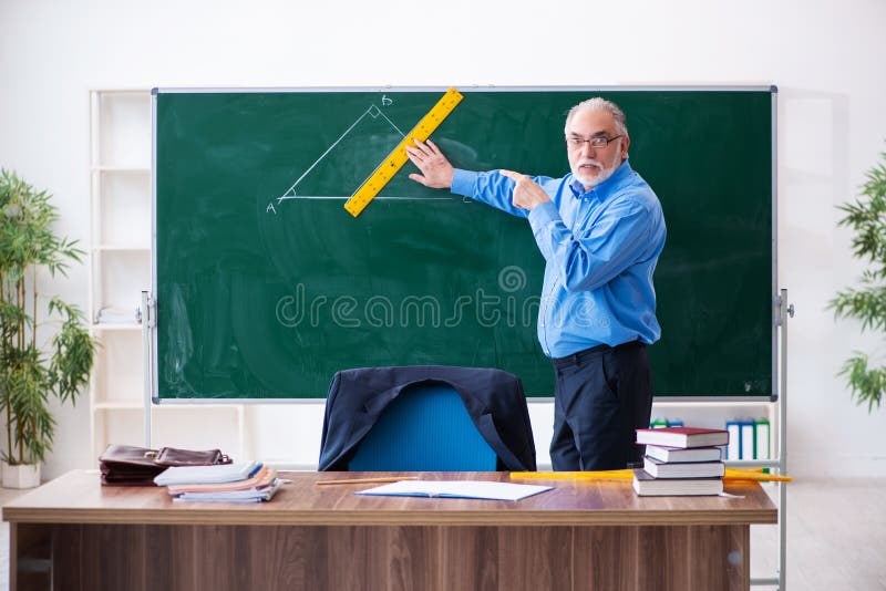 Old Male Geometry Teacher Holding Triangle Stock Photo - Image of ...
