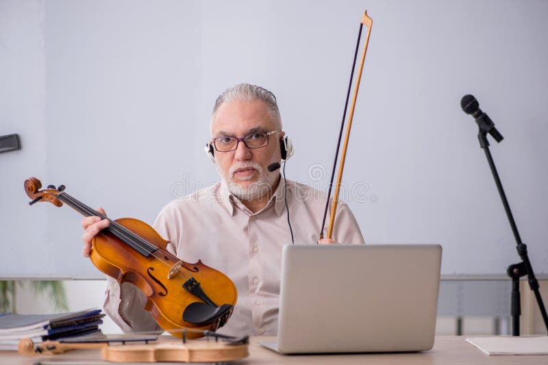 Old Male Music Teacher in the Classroom Stock Photo - Image of ...