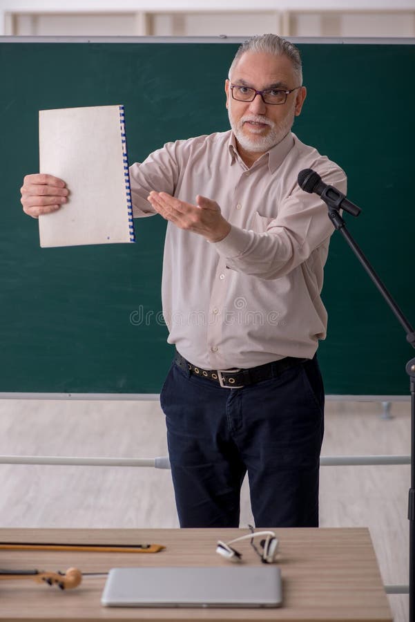 Old Male Music Teacher in the Classroom Stock Photo - Image of teaching ...