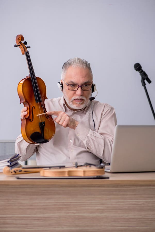 Old Male Music Teacher in the Classroom Stock Photo - Image of online ...