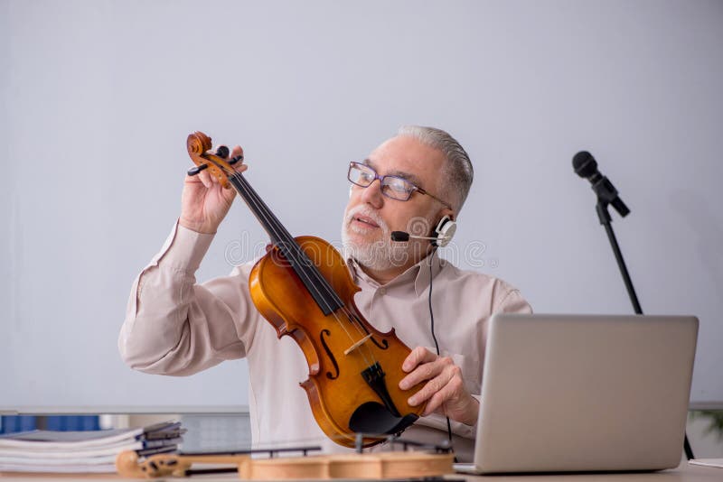 Old Male Music Teacher in the Classroom Stock Photo - Image of ...