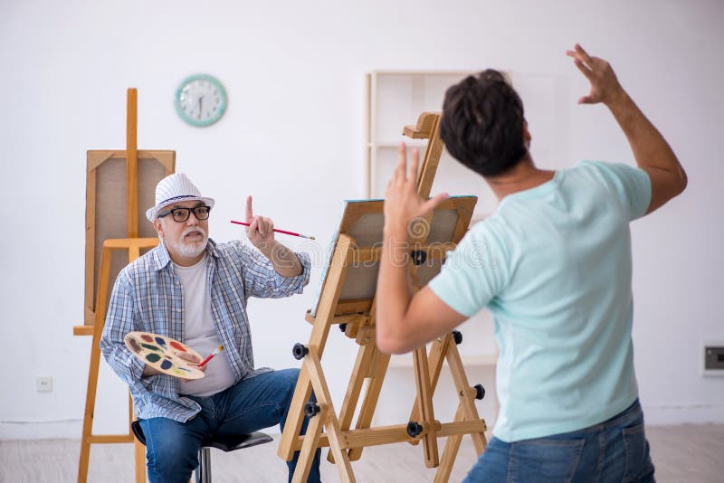 Old Painter and Young Male Model at the Studio Stock Photo - Image of ...