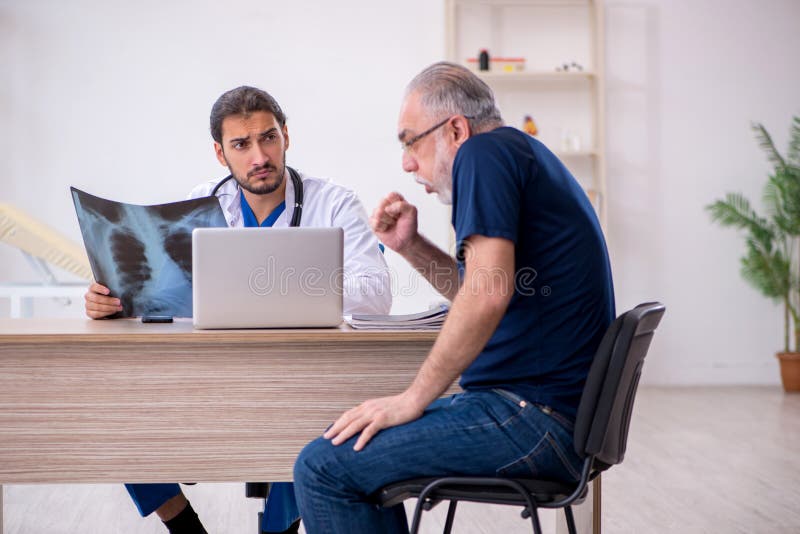 Old Male Patient Visiting Young Male Doctor Radiologist Stock Image ...