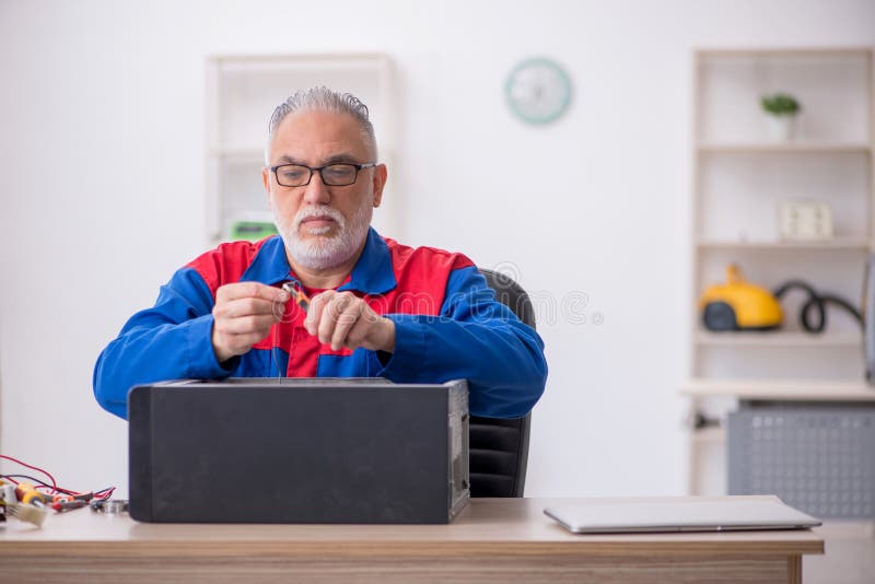 Old Male Repairman Repairing Computer Stock Photo - Image of computer ...