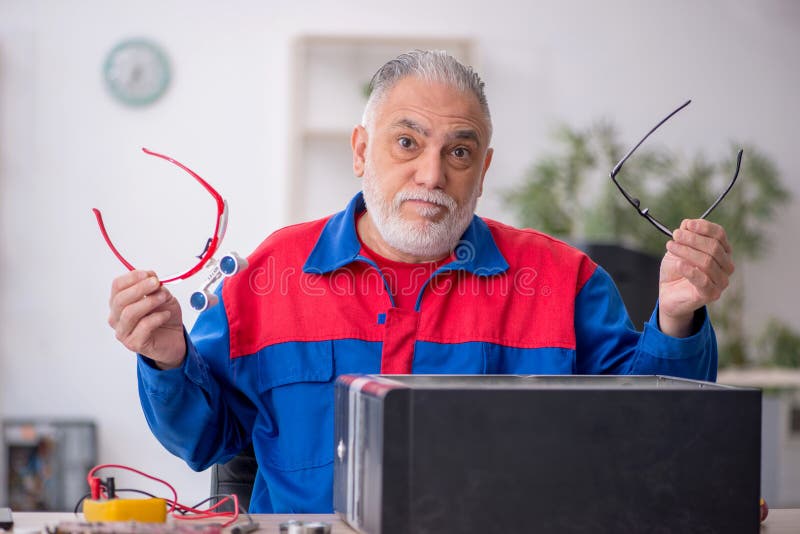 Old Male Repairman Repairing Computer Stock Photo - Image of repair ...