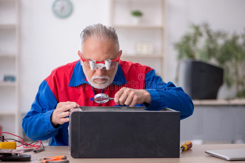 Old Male Repairman Repairing Computer Stock Photo - Image of fixing ...
