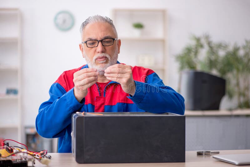 Old Male Repairman Repairing Computer Stock Photo - Image of parts ...