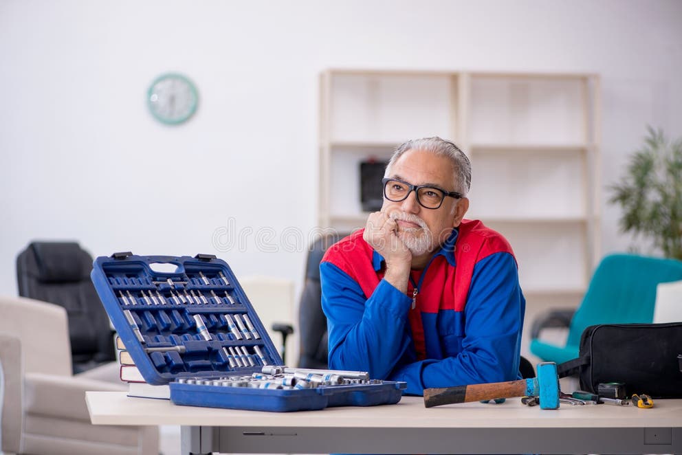 Old Male Repairman Working at Workshop Stock Photo - Image of bored ...