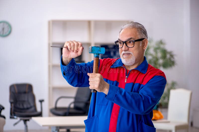 Old Male Repairman Working at Workshop Stock Image - Image of chair ...