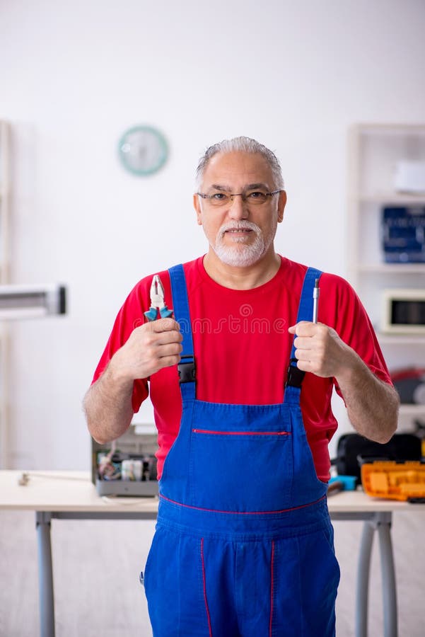 Old Male Repairman at Workshop Stock Photo - Image of maintenance ...