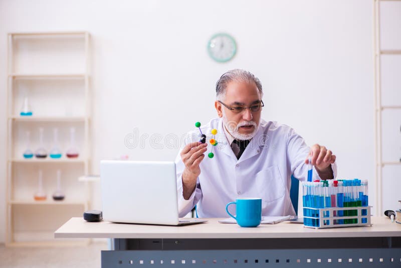 Old Male Scientist Studying Molecular Model Stock Photo - Image of ...
