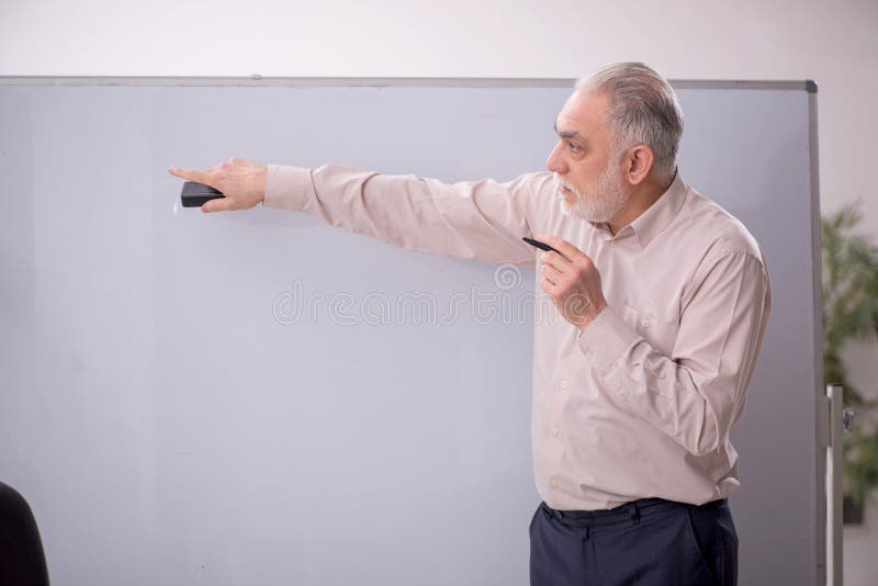 Old Male Teacher in the Classroom Stock Image - Image of lecture ...