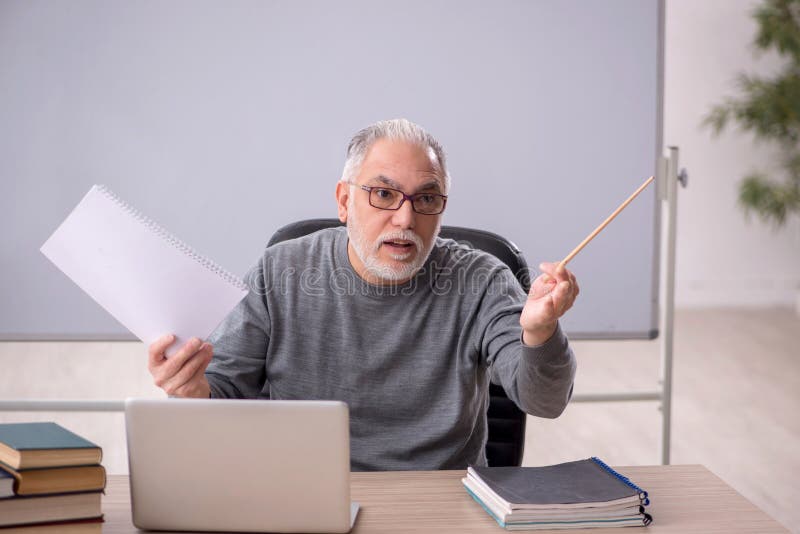 Old Male Teacher in the Classroom Stock Image - Image of explaining ...