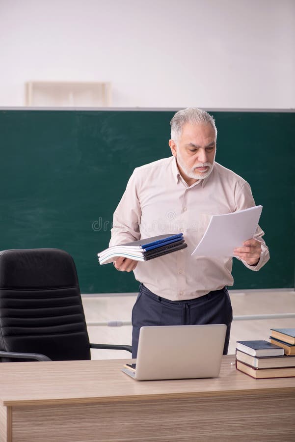 Old Male Teacher in the Classroom Stock Photo - Image of discussing ...