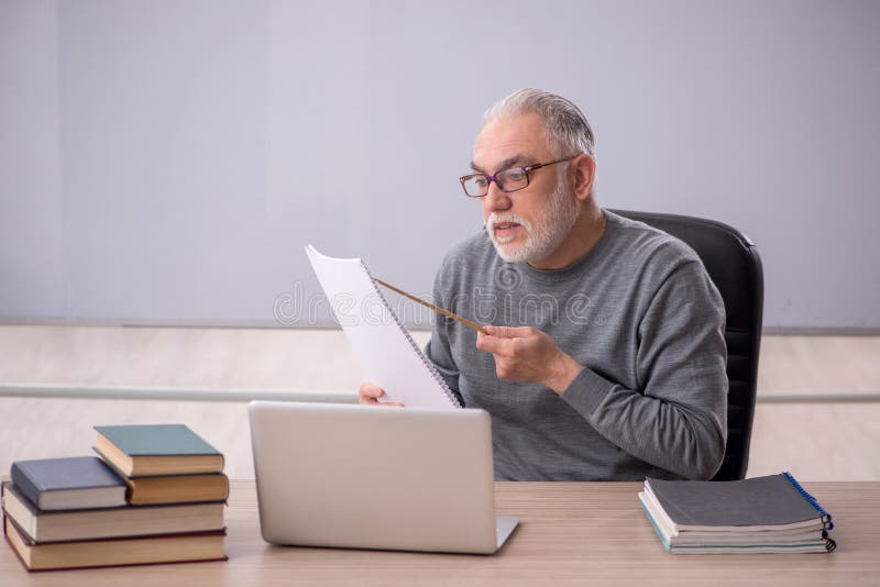 Old Male Teacher in the Classroom Stock Image - Image of teacher ...