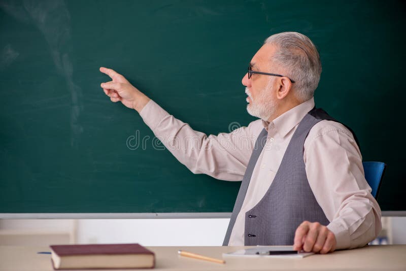 Old Male Teacher in the Classroom Stock Image - Image of demonstrating ...