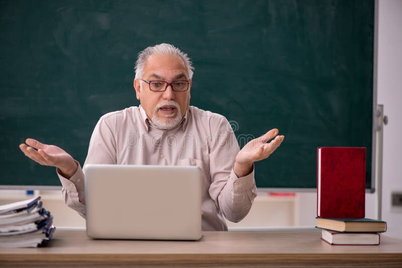 Old Male Teacher in Front of Green Board Stock Photo - Image of ...