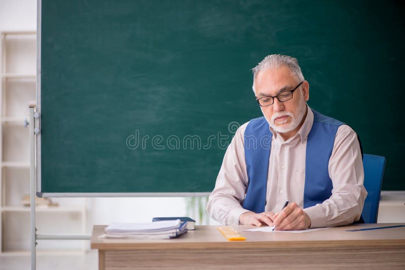 Old Male Teacher in Front of Green Board Stock Photo - Image of ...