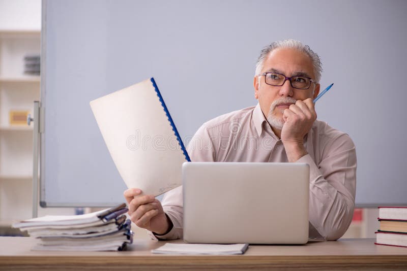 Old Male Teacher in Front of Whiteboard Stock Photo - Image of reading ...