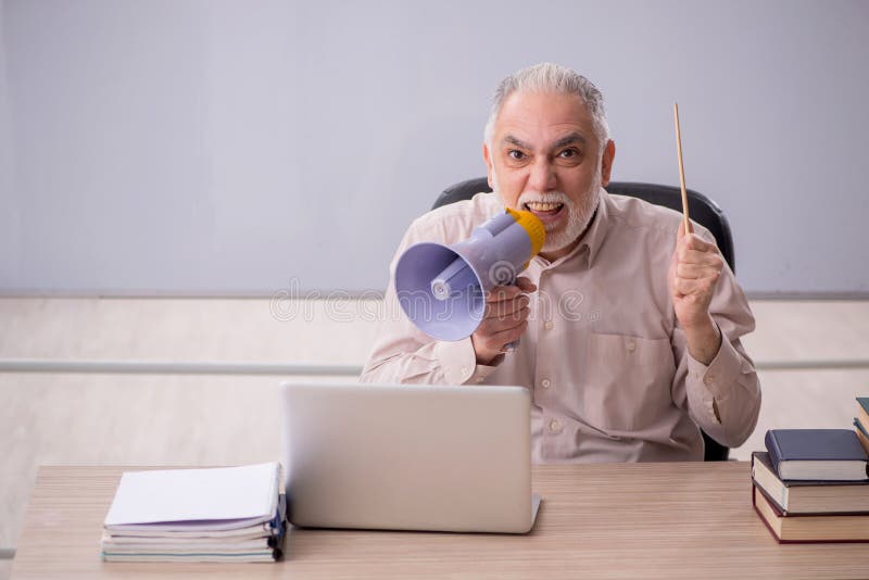 Old Male Teacher Holding Megaphone in the Classroom Stock Image - Image ...