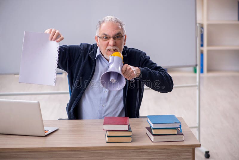 Old Male Teacher Holding Megaphone in the Classroom Stock Photo - Image ...