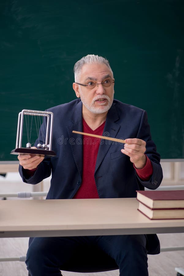 Old Male Teacher Physicist Sitting in the Classroom Stock Image - Image ...