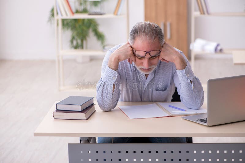 Old Male Teacher in the Classroom Stock Image - Image of concerned ...