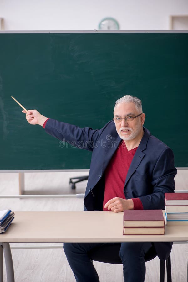 Old Male Teacher Sitting in the Classroom Stock Photo - Image of ...
