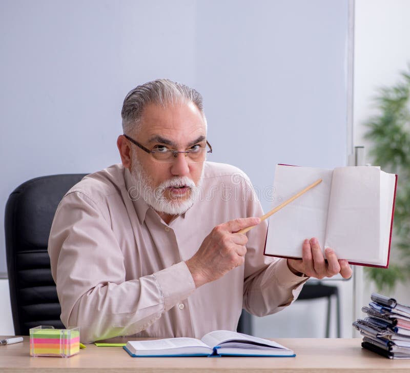 Old Male Teacher Sitting in the Classroom Stock Image - Image of ...