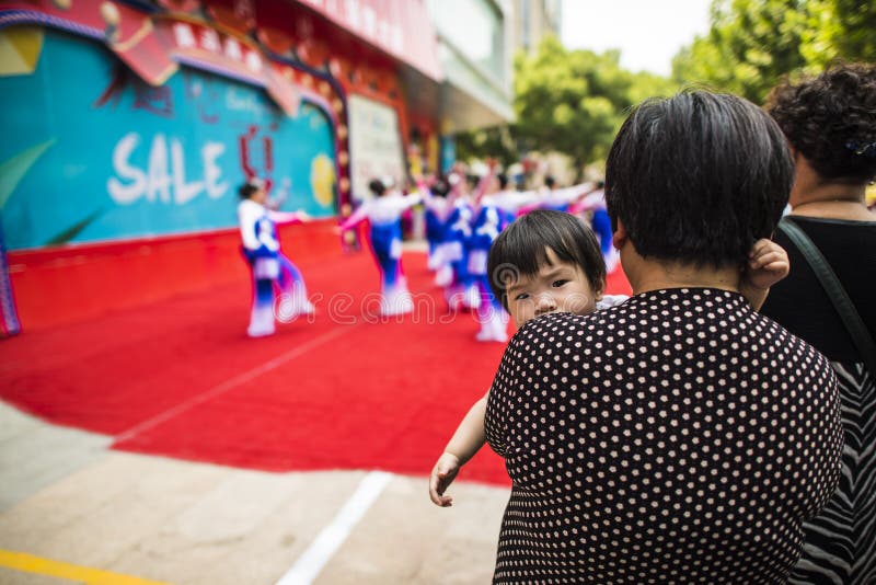 An Old Man with a Baby Watching a Performance Editorial Photo - Image ...