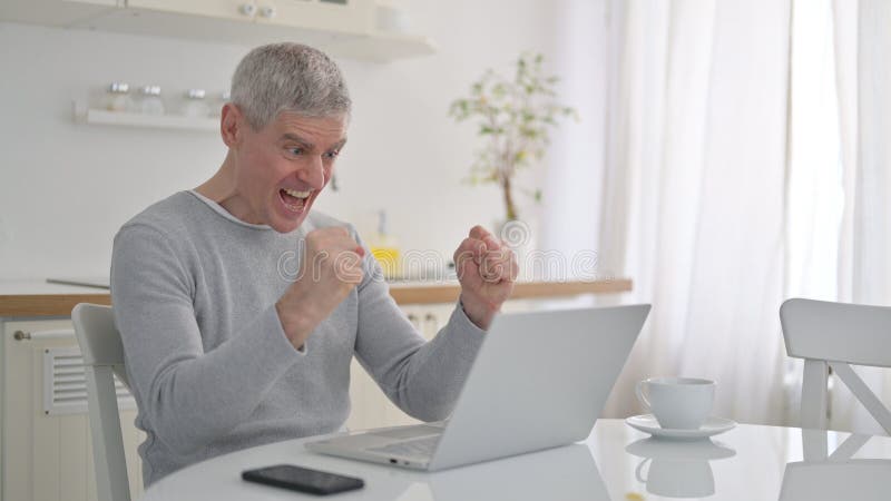 Old Man Celebrating Success on Laptop at Home Stock Photo - Image of ...