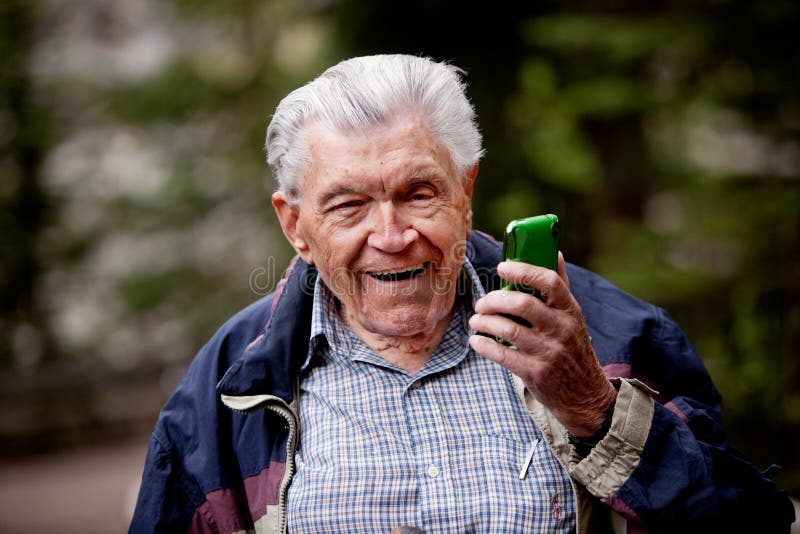 Old Man with Cell Phone stock image. Image of phone, outside - 15669487
