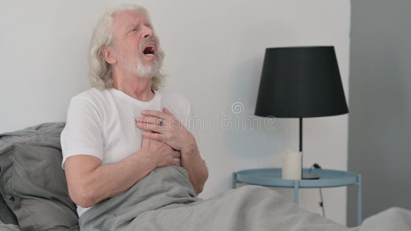 Old Man with Chest Pain Sitting in Bed, Heart Attack Stock Photo ...