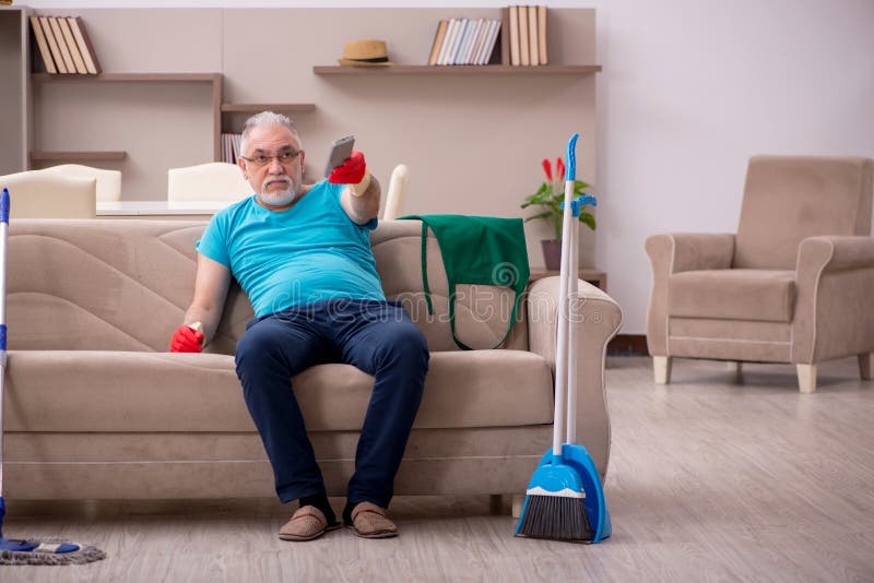 Old man cleaning the house stock photo. Image of janitor - 226886974