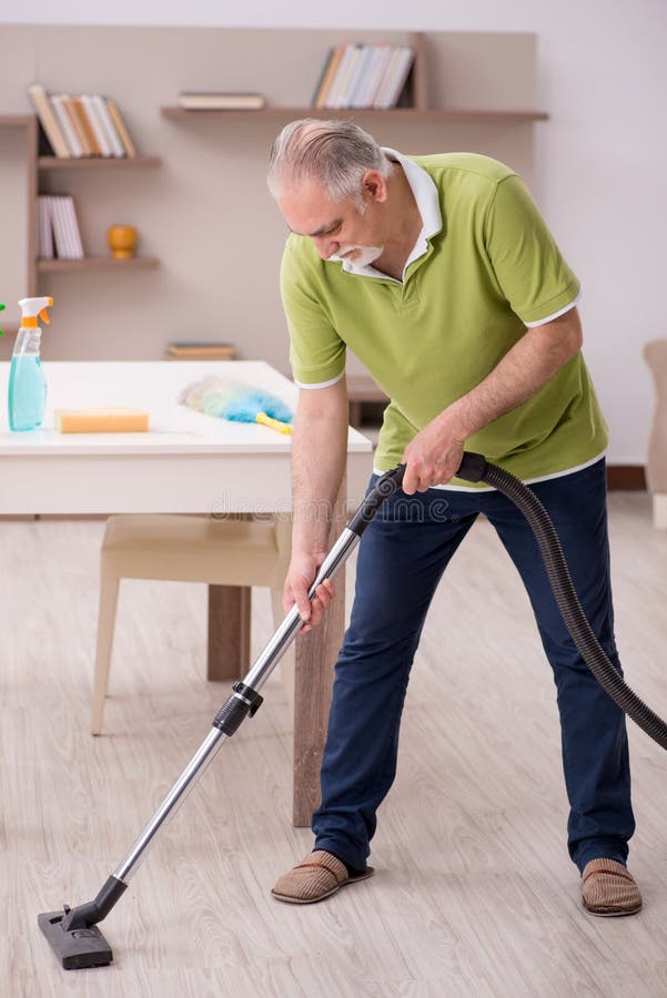 Old man cleaning the house stock photo. Image of cleanser - 227023546