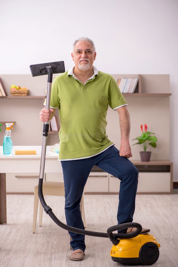Old man cleaning the house stock photo. Image of routine - 227023606