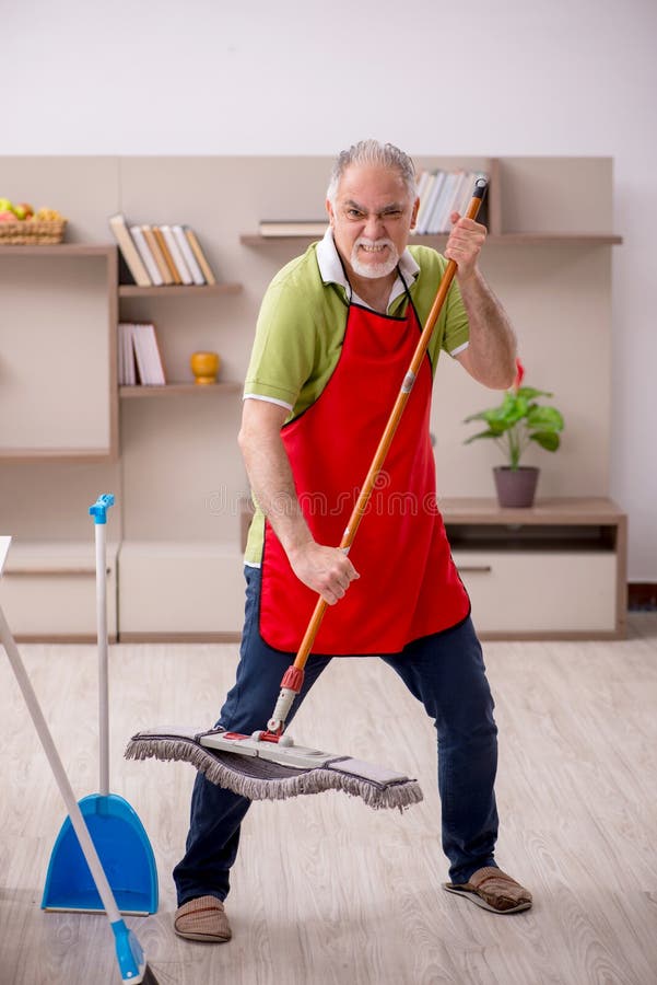Old man cleaning the house stock image. Image of maid - 227023885