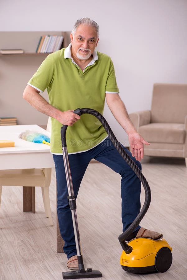 Old man cleaning the house stock photo. Image of housework - 231185312