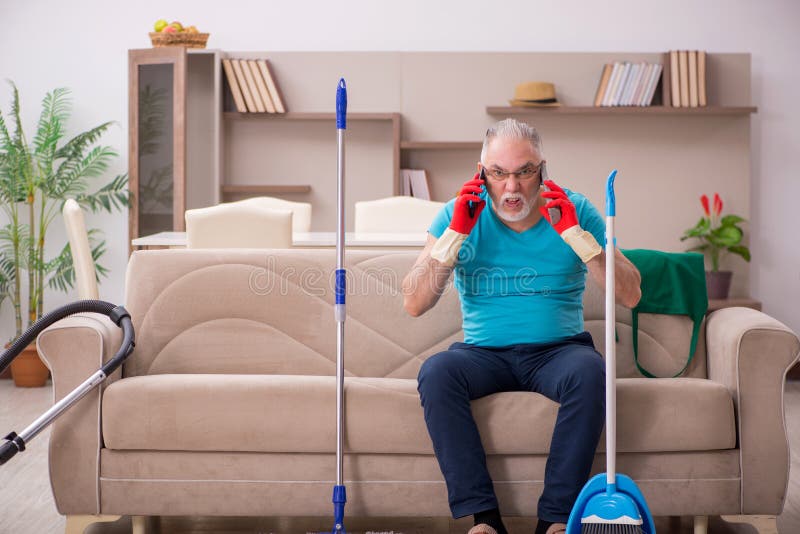 Old man cleaning the house stock photo. Image of mobile - 233078056