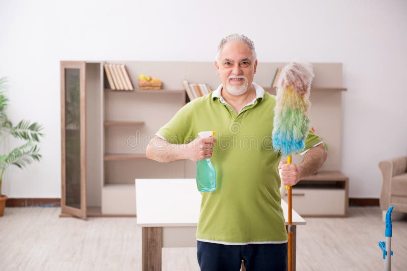 Old man cleaning the house stock image. Image of cleaner - 234242009