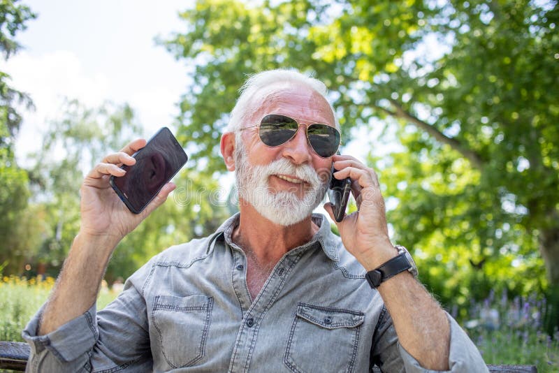 Old Man Compare Two Smartphones Stock Image - Image of phone, adult ...