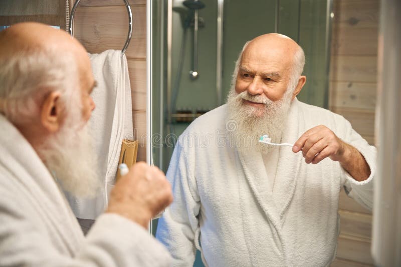 Old Man Doing His Morning Routine in the Bathroom Stock Image - Image ...