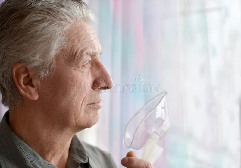 An Old Man Doing Inhalation Stock Photo - Image of inhaler, medicine ...