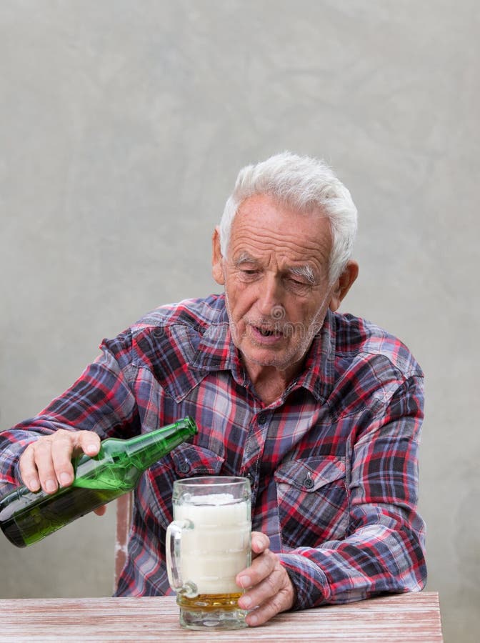 Old man drinking beer stock photo. Image of aged, leisure - 135492048