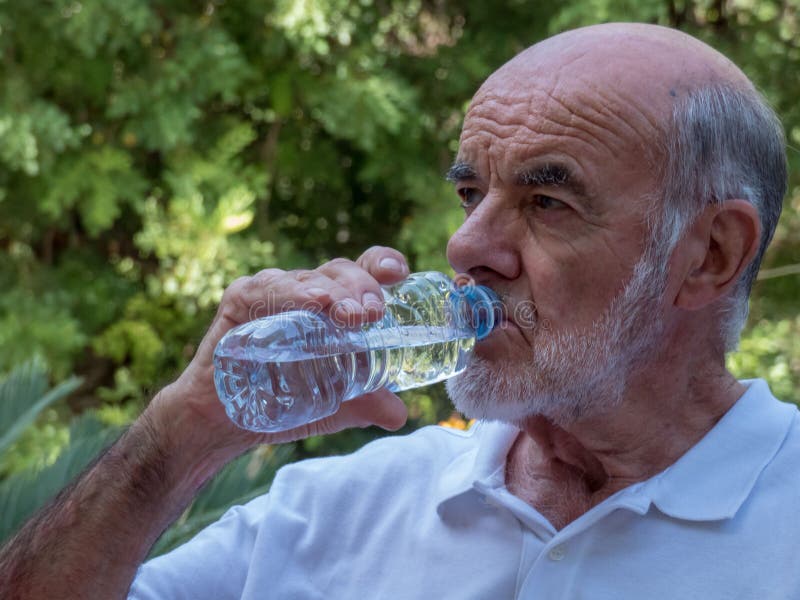Old Man Drinking Fresh Water from the Bottle. Stock Image - Image of ...