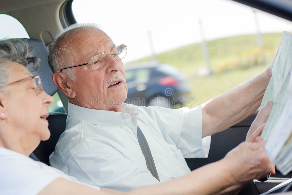 Old Man Driving Car while Checking Map Stock Photo - Image of glasses ...
