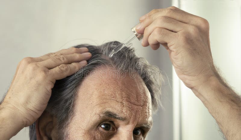 Old Man Dropping Serum Onto His Hair Stock Image - Image of white ...